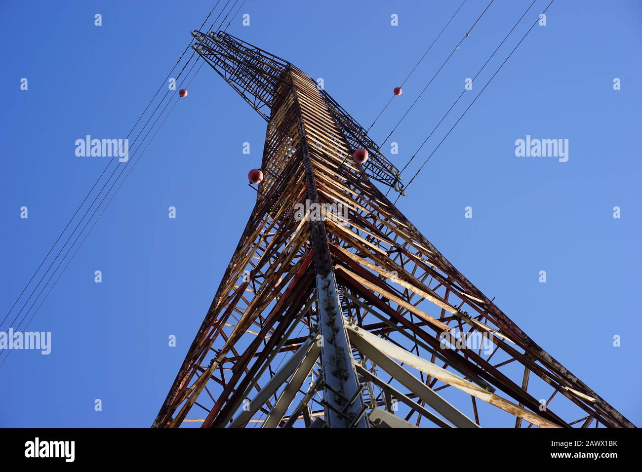 Electric pole with blue sky as background Stock Photo - Alamy