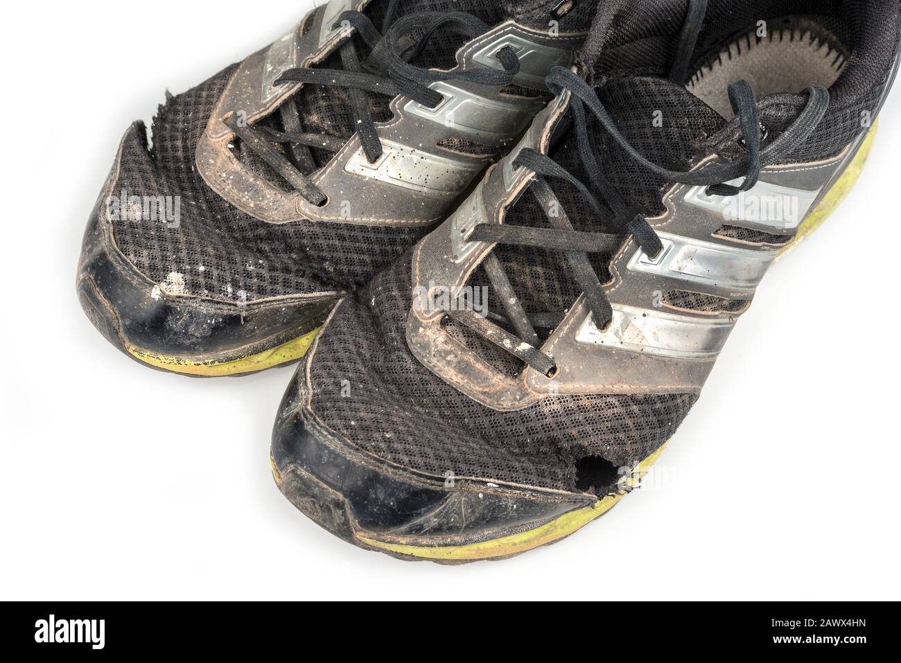Old used sneakers. Torn training shoes Stock Photo - Alamy