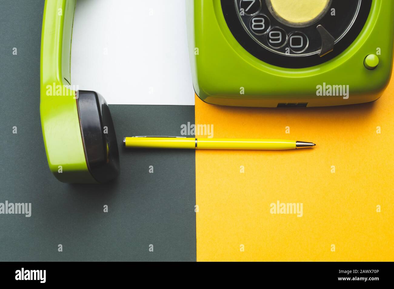 Classic phone with handset. pen with a note. office background. vintage ...