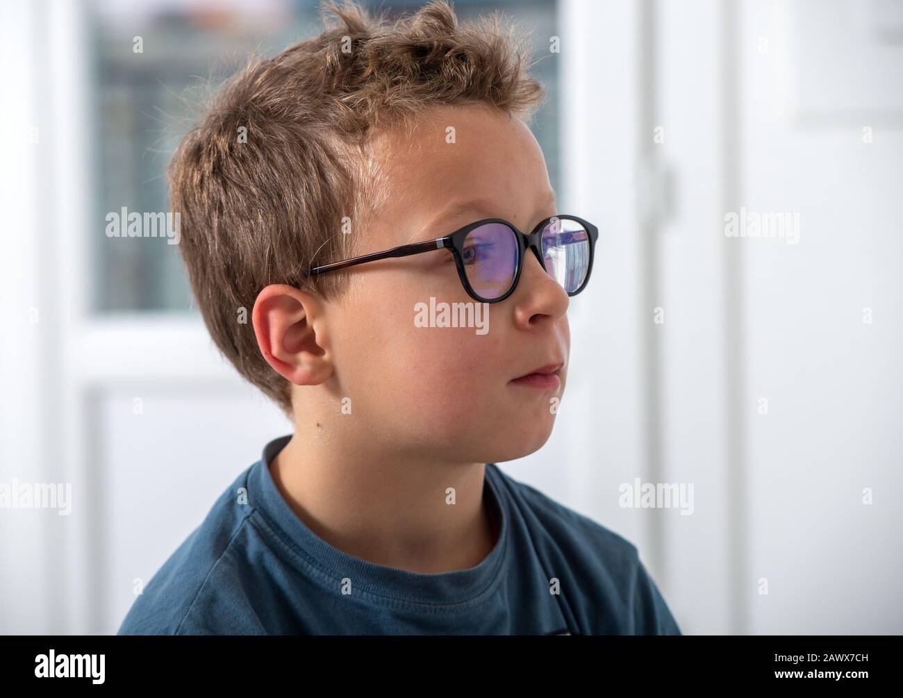 a portrait of a boy with glasses Stock Photo - Alamy