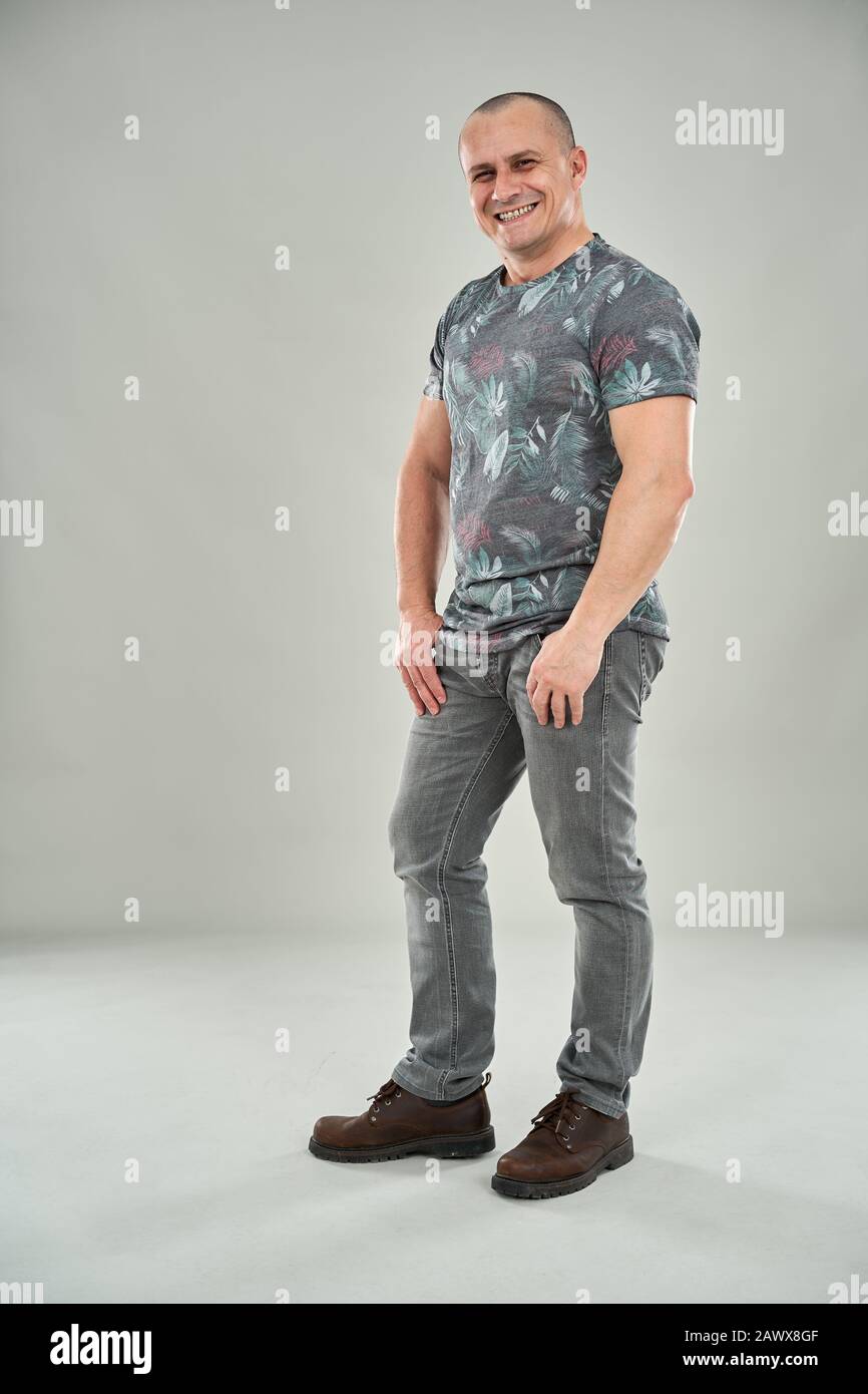 Portrait of a caucasian man on gray background, full body Stock Photo ...