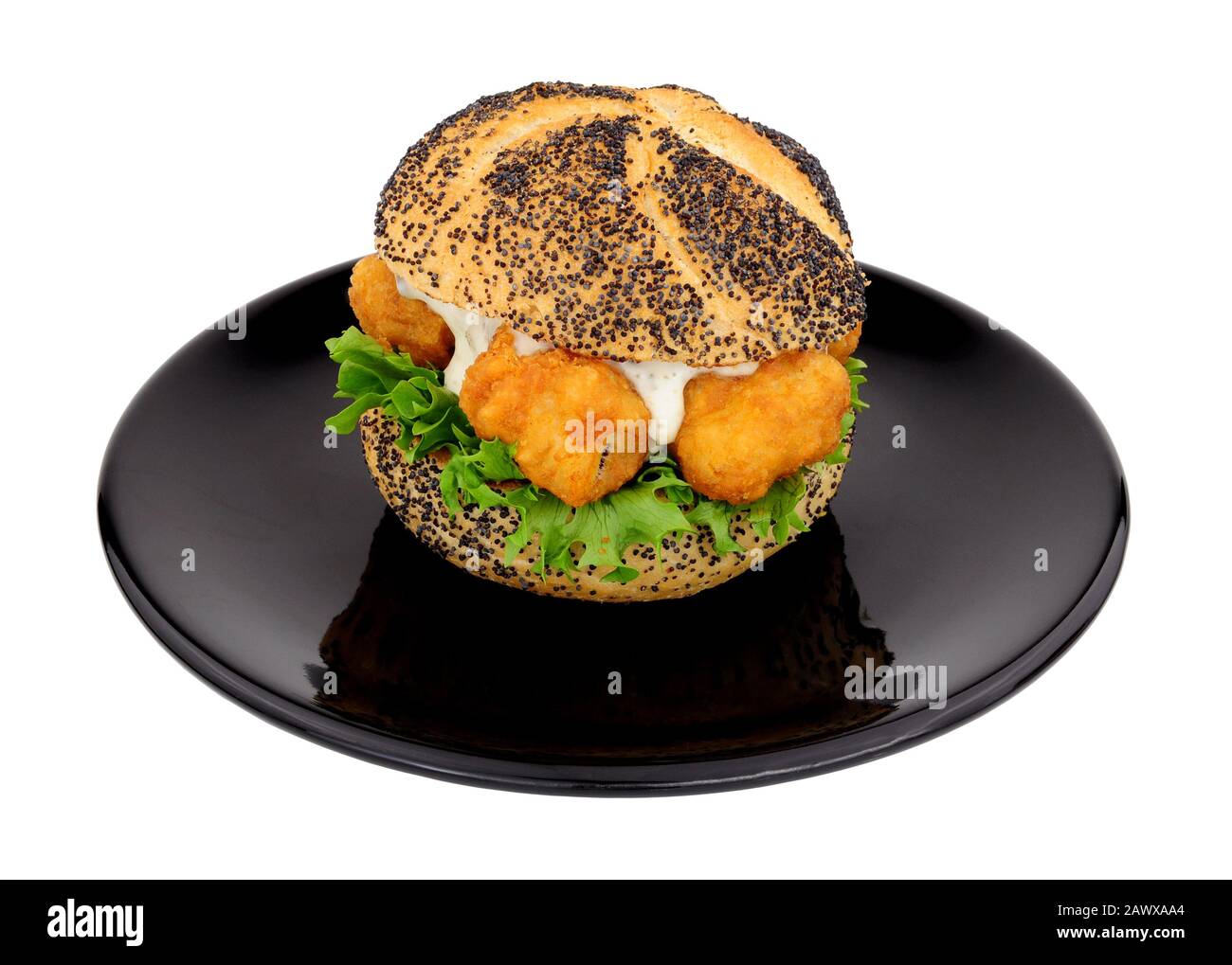 Battered cod fish nugget sandwich with tartare sauce and lettuce on a ...