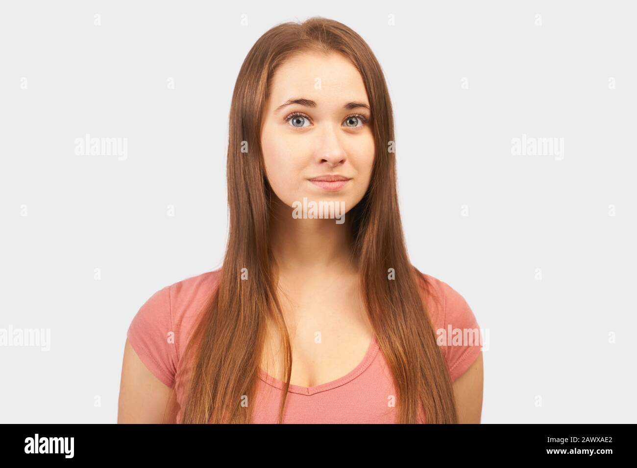 Sweet looking girl looks at camera, gentle smile Stock Photo - Alamy