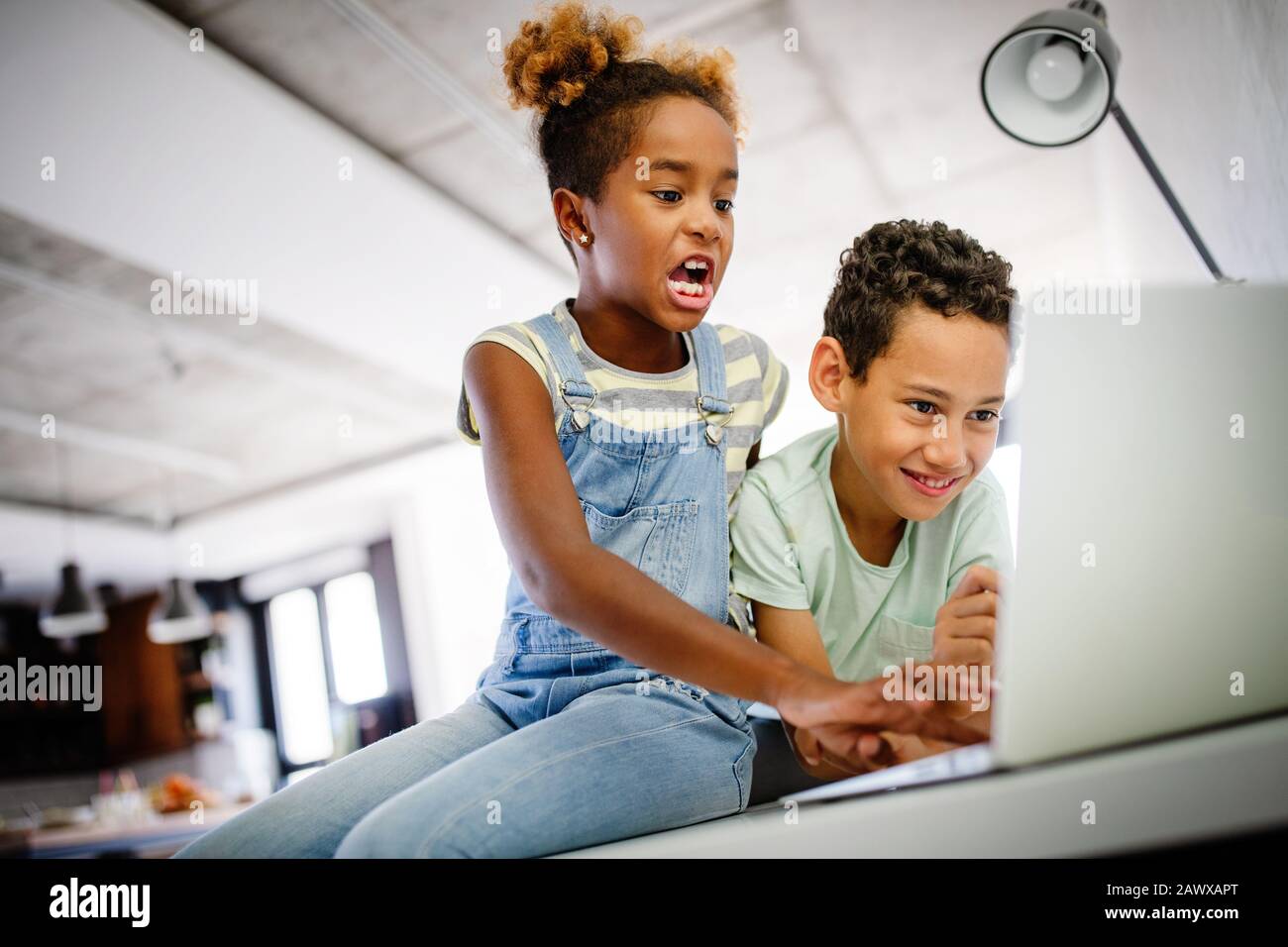 Kids, technology concept. Happy children using laptop to learn, play ...