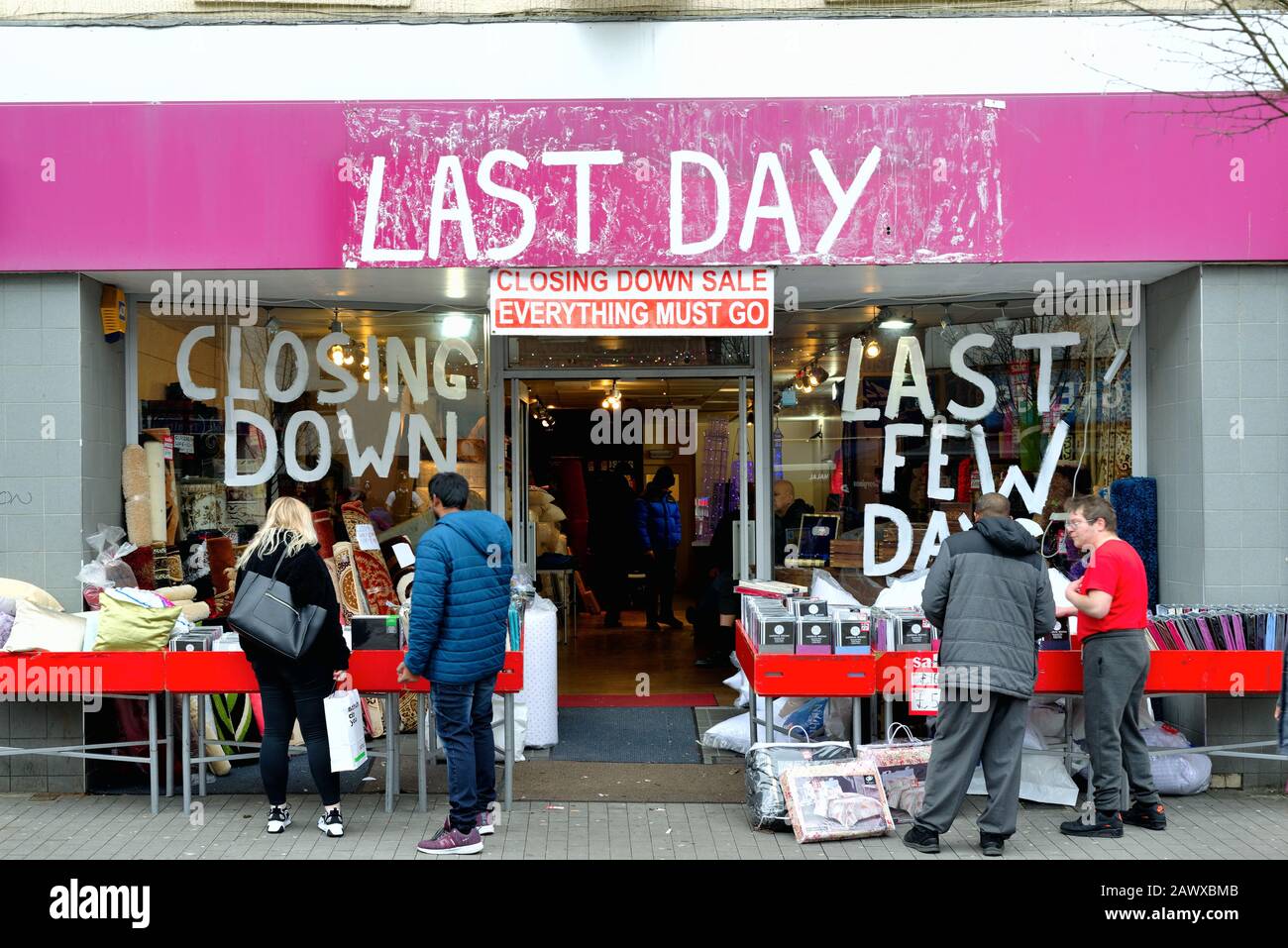 A low price goods shop with a crude hand painted signs announcing last ...