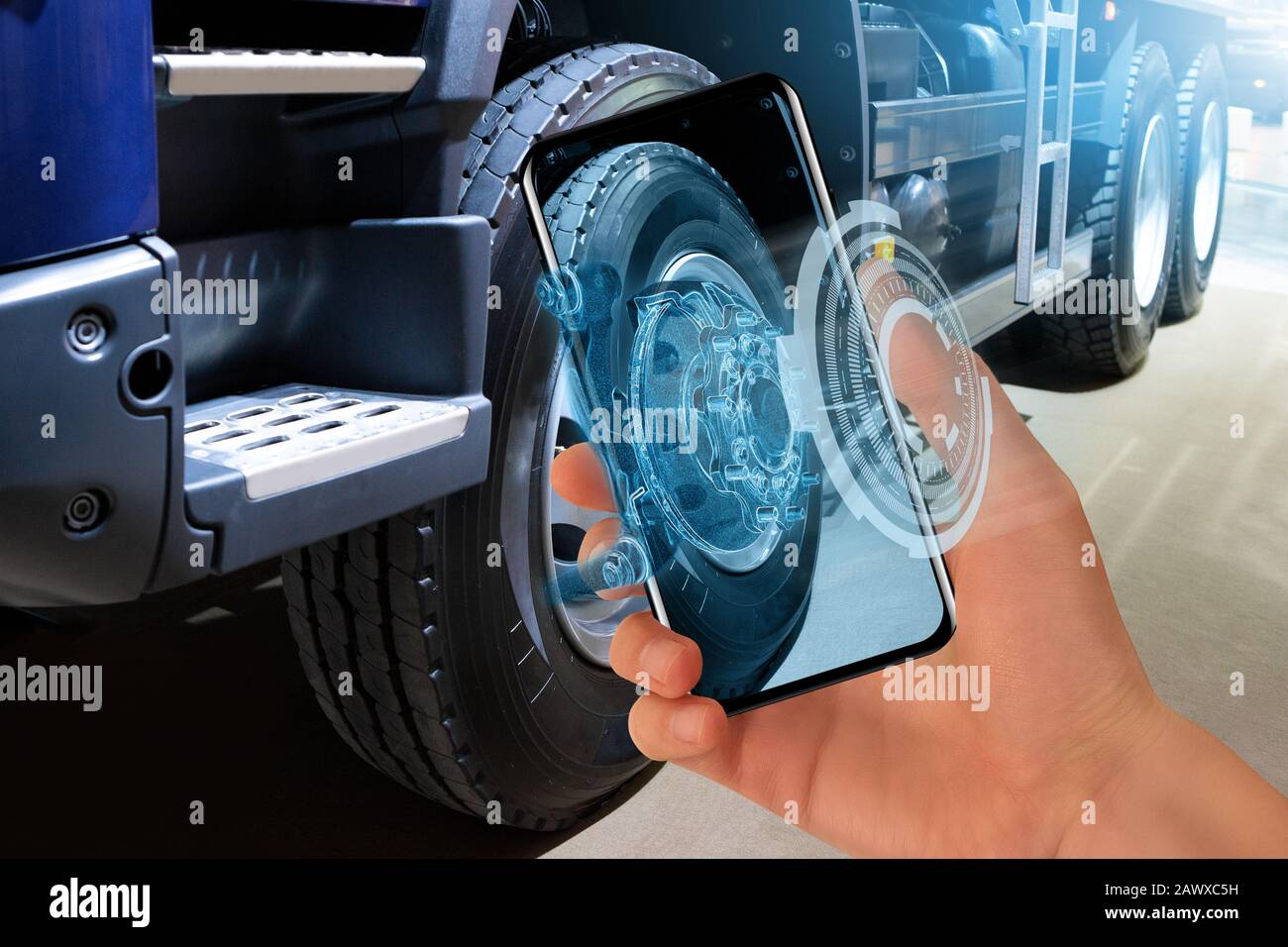 Serviceman repairing a truck using augmented reality application Stock ... Serviceman repairing a truck using augmented reality application Stock ...