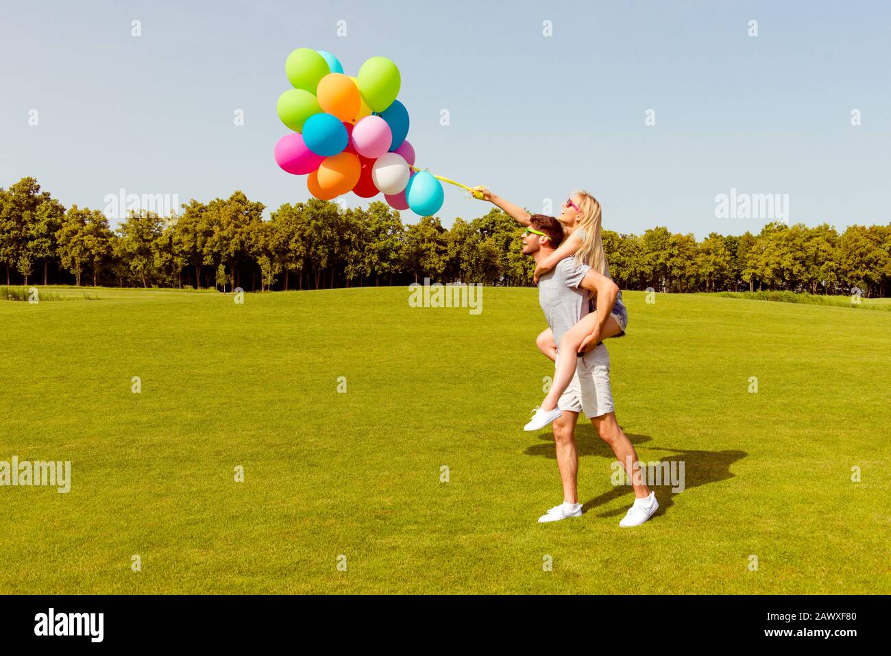Family joy back balloons hi-res stock photography and images - Alamy
