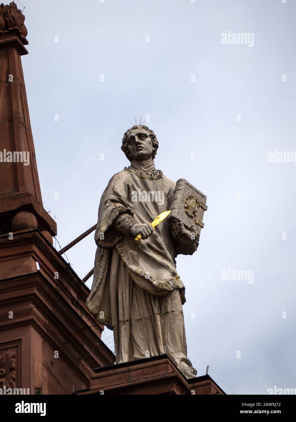 WURZBURG, GERMANY - 07/08/2019: Statue of Saint Colman on the facade of ...