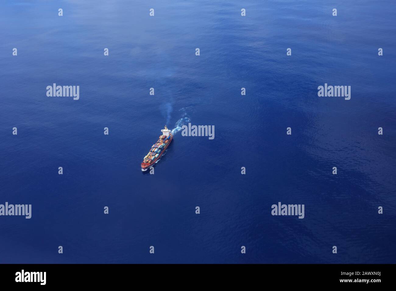 Container cargo ship in the open ocean Stock Photo - Alamy