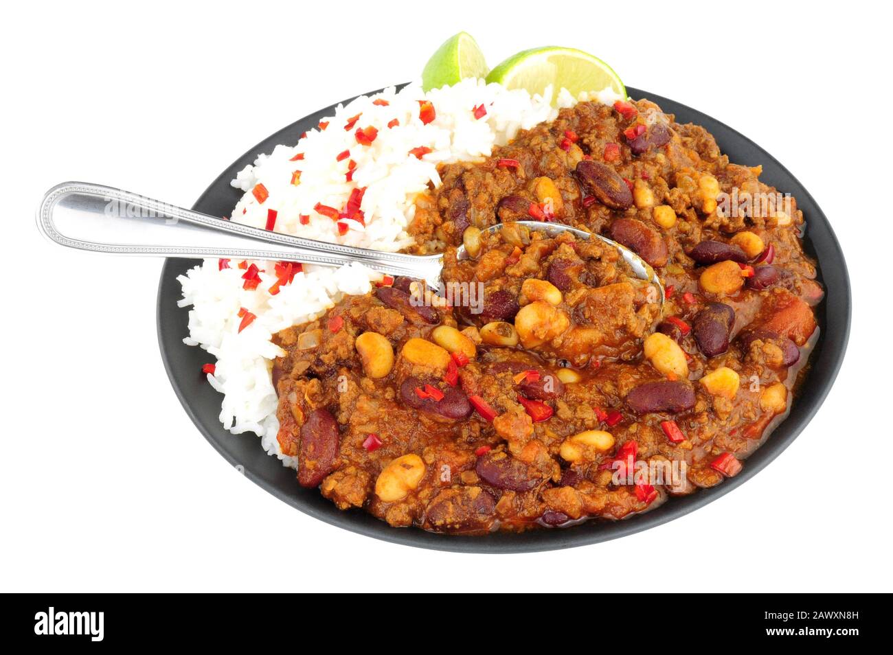 Chilli Con Carne with boiled rice on a black plate isolated on a white ...