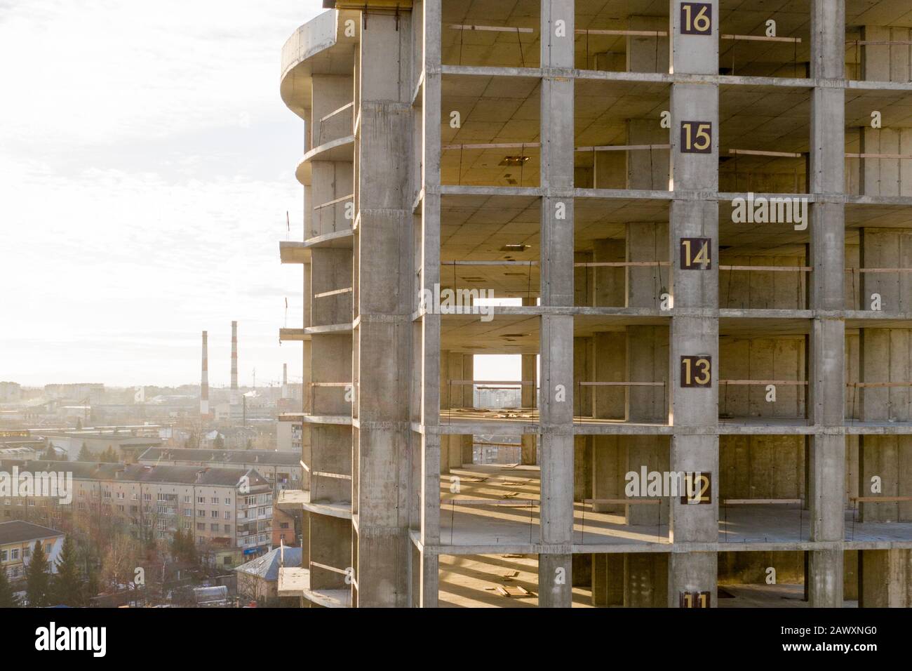 Aerial view of concrete frame of tall apartment building under ...