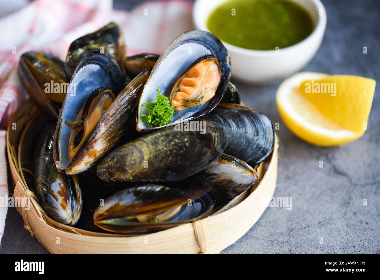 Mussels with herbs lemon on cook steamer food background / Fresh ...