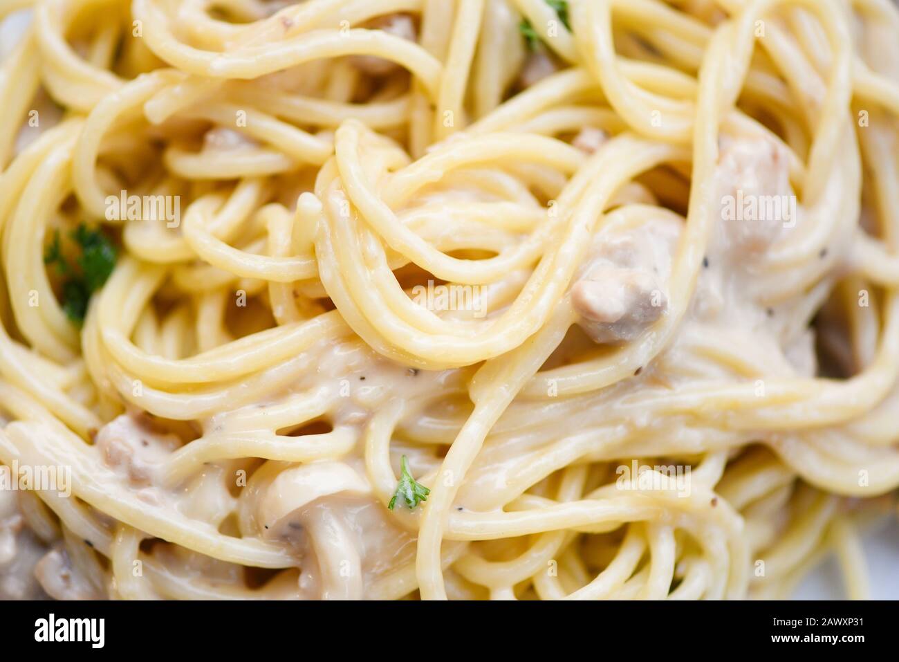 Spaghetti italian pasta served on plate with parsley in the restaurant ...