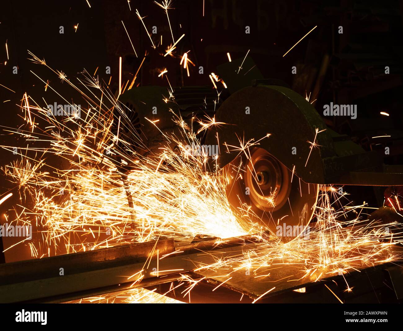 cutting a metal with the sparkling particles Stock Photo - Alamy