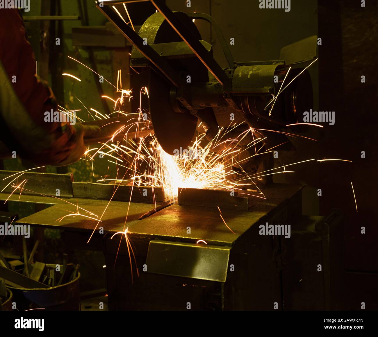 cutting a metal with the sparkling particles Stock Photo - Alamy