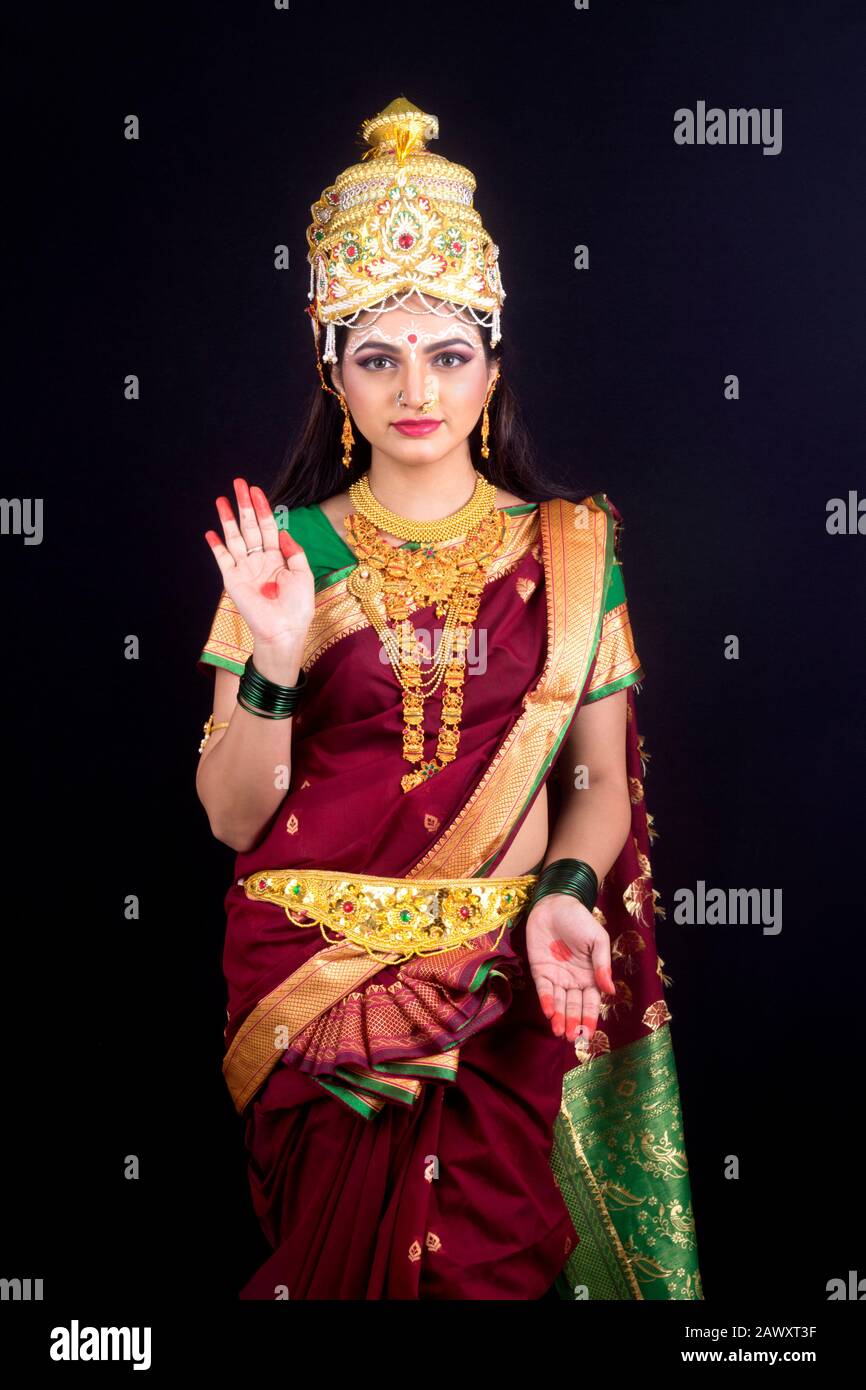 Indian model dressed like Goddess Laxmi in traditional saree, Jewel ...