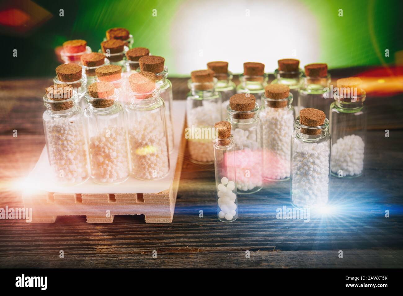 Homeopathic lactose sugar globules in glass bottles Stock Photo - Alamy