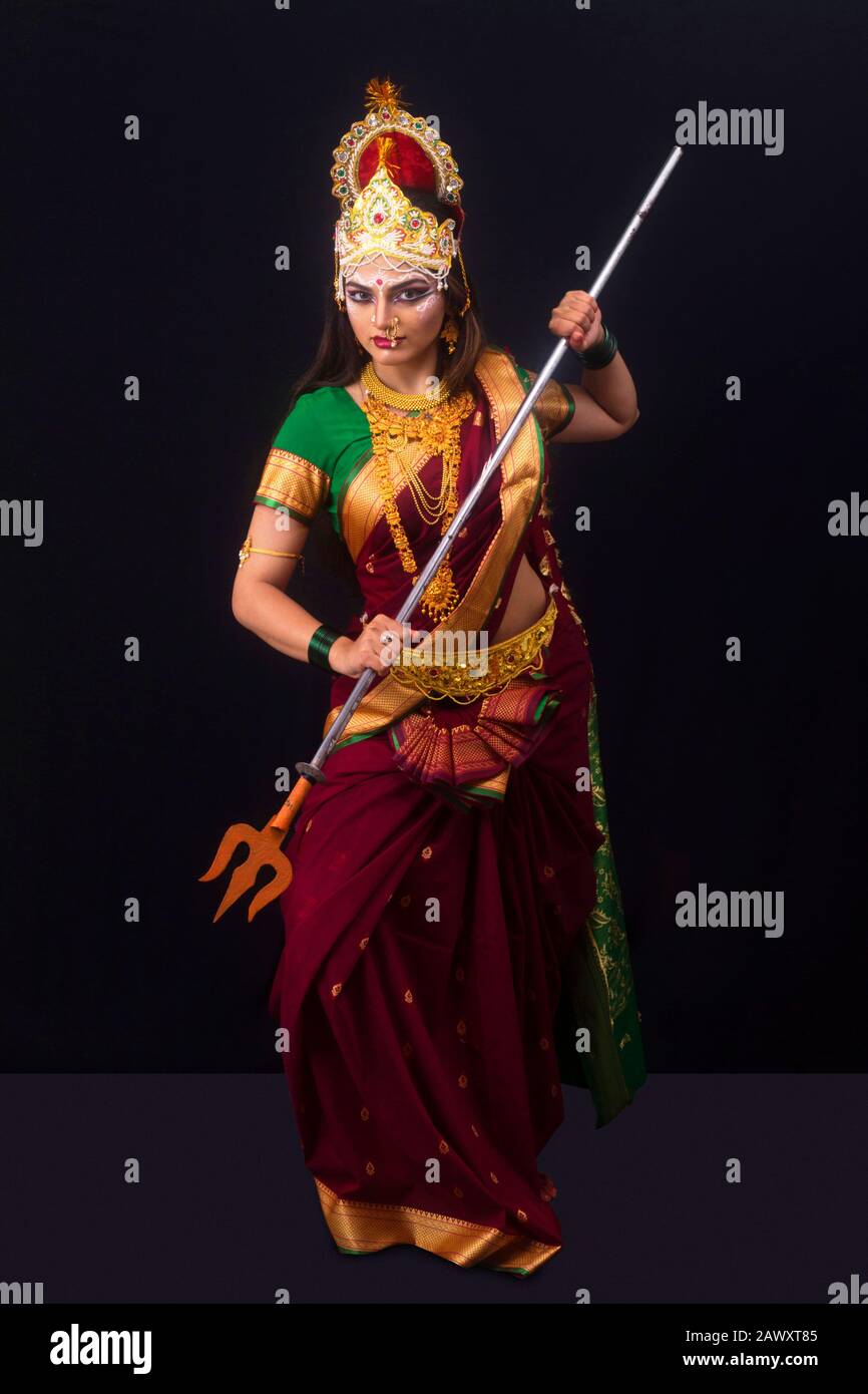 Indian model dressed like Goddess Laxmi in traditional saree, Jewel ...