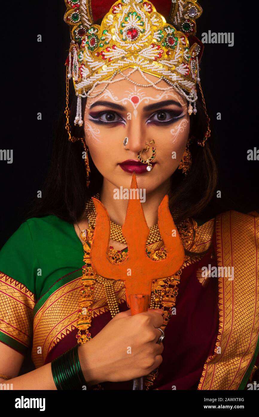 Indian model dressed like Goddess Laxmi in traditional saree, Jewel ...