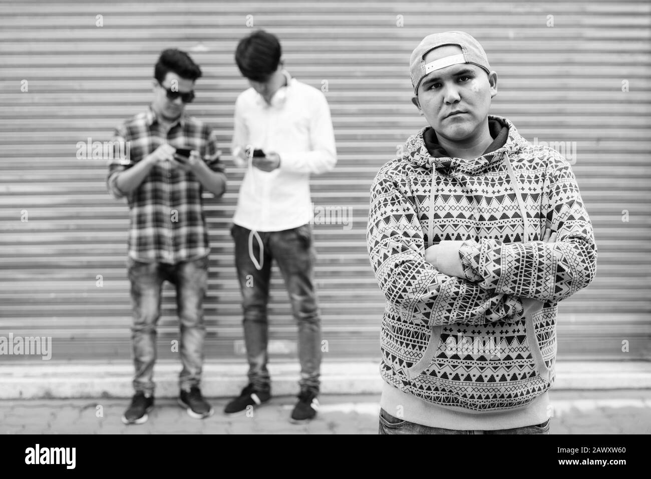 Three young Asian men standing in the streets outdoors Stock Photo - Alamy