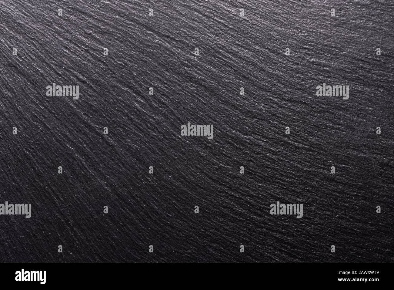 black stone, texture for the background. smooth shadows and light on ...