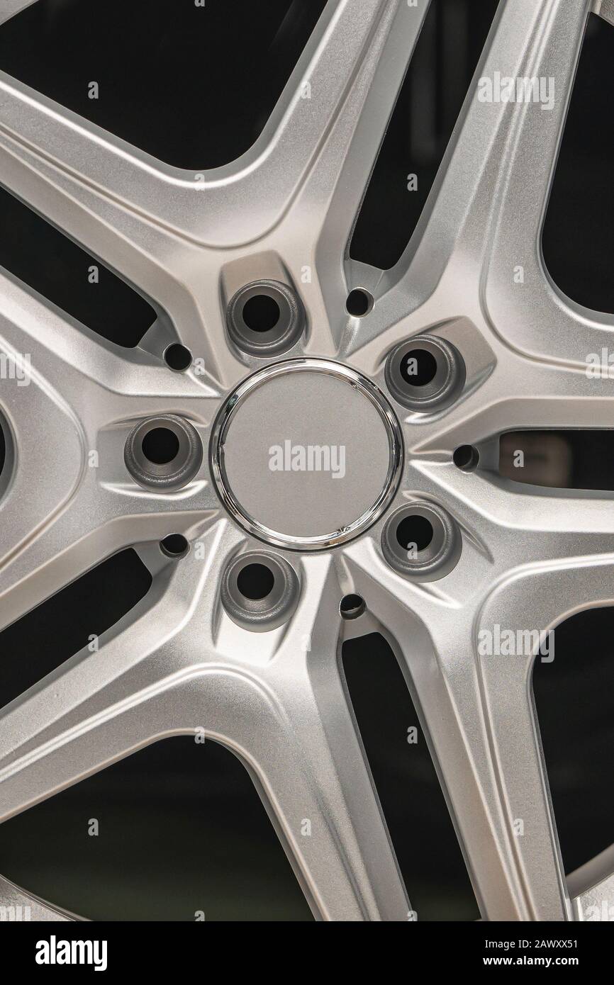 alloy wheel silver, rim new car wheel on a black background close up ...