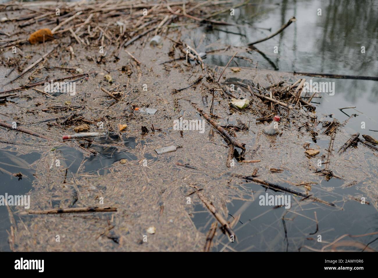 Garbage floating in dirty water. Environmental pollution Stock Photo ...