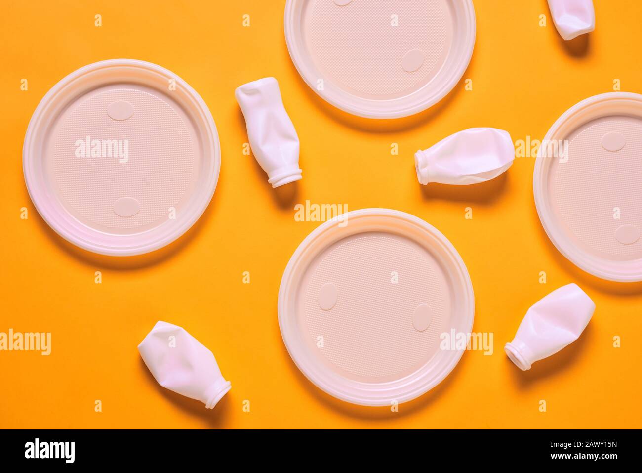 Horizontal from above flat lay shot of white plastic empty plates and ...