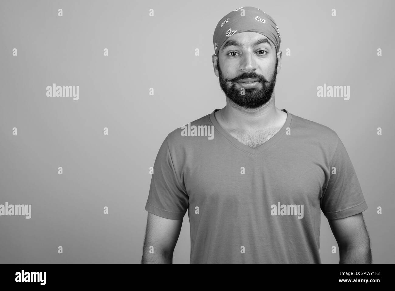 Portrait of young handsome bearded Indian man Stock Photo - Alamy