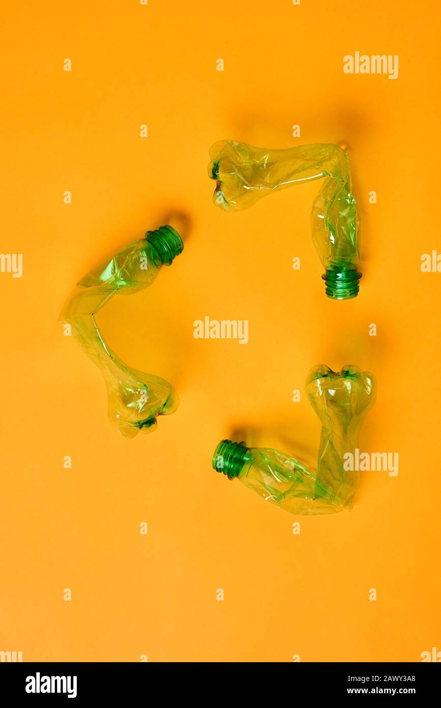 Vertical flat lay shot of triangle recycling symbol made out of empty ...