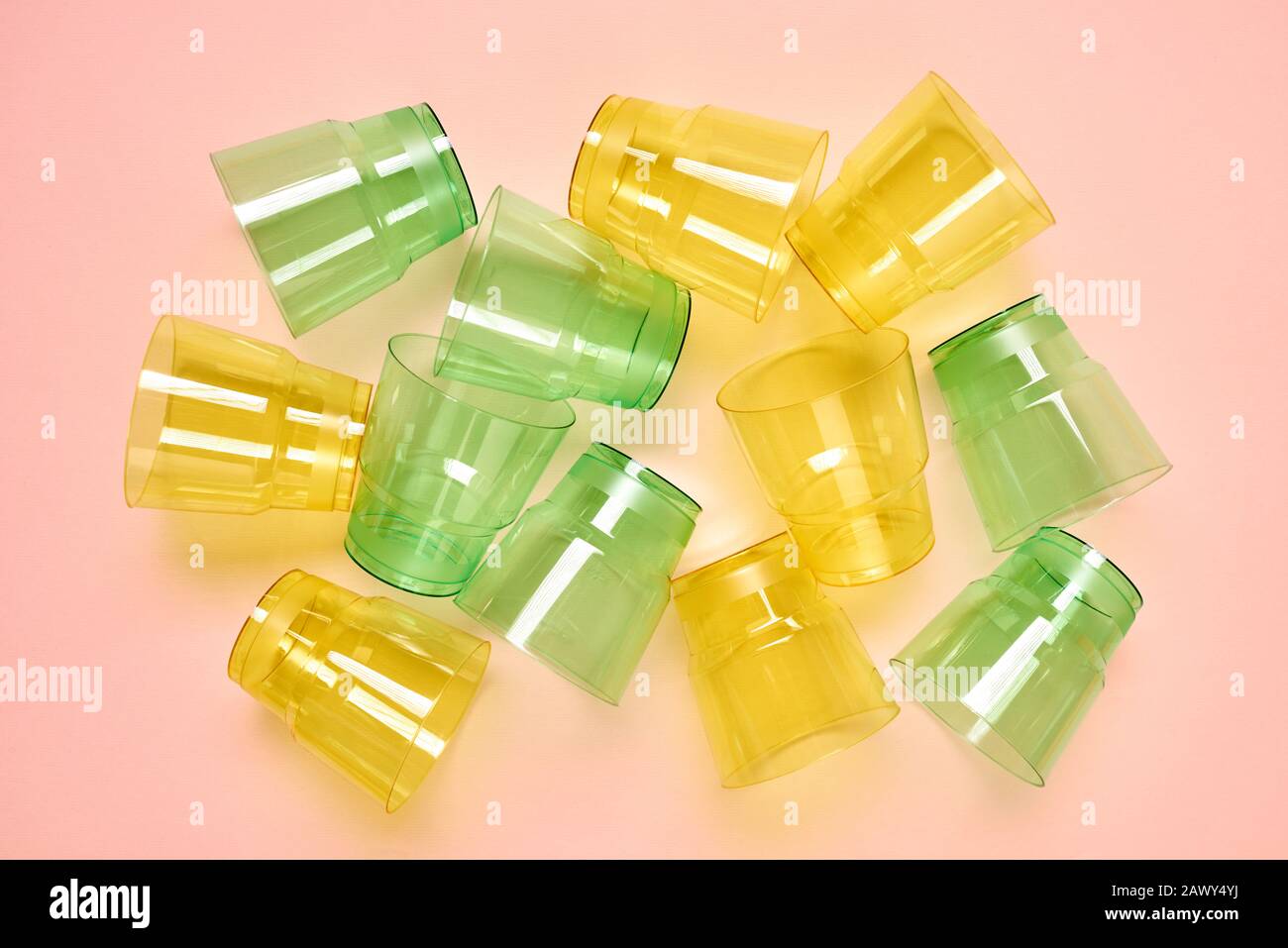 Horizontal from above flat lay shot of transparent green and yellow ...