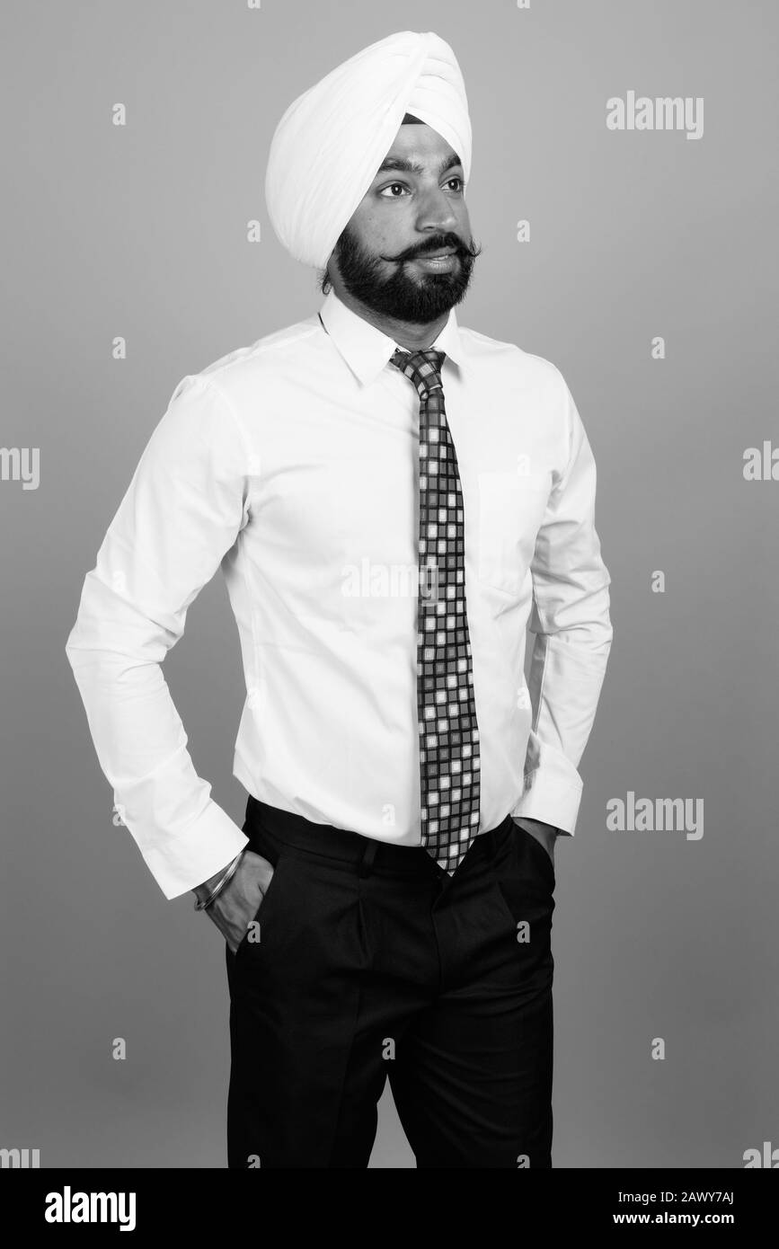 Portrait of young bearded Indian Sikh businessman with turban Stock ...