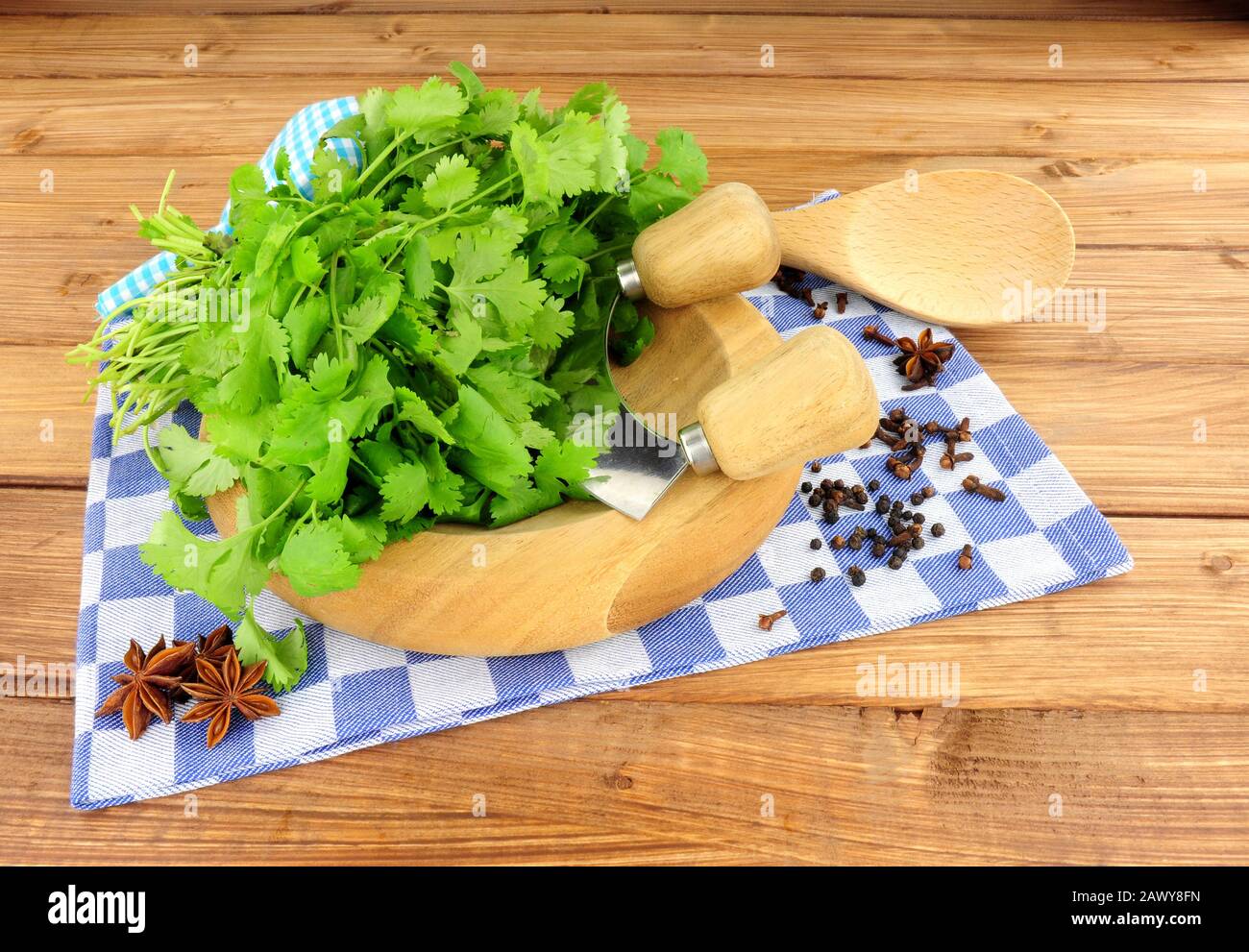 Bunch of fresh coriander on a wooden herb chopping board Stock Photo ...