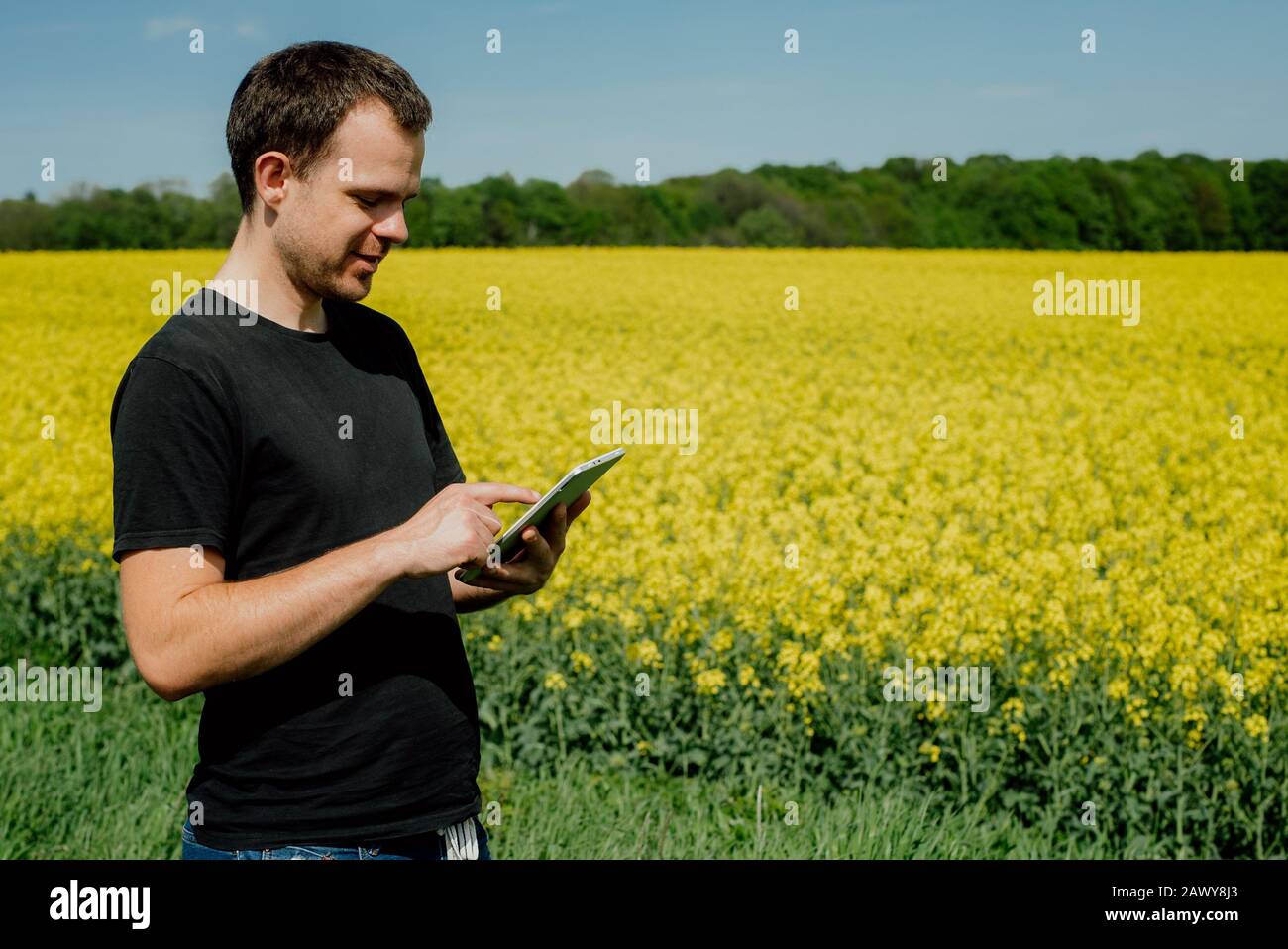 Farmer holding tablet Stock Photo - Alamy