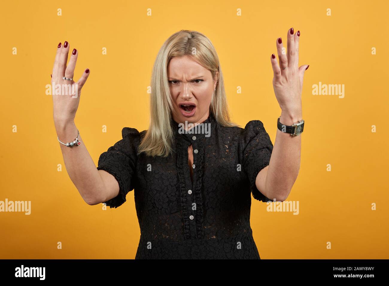 girl in black dress angry angry woman screams raised her hands in the ...