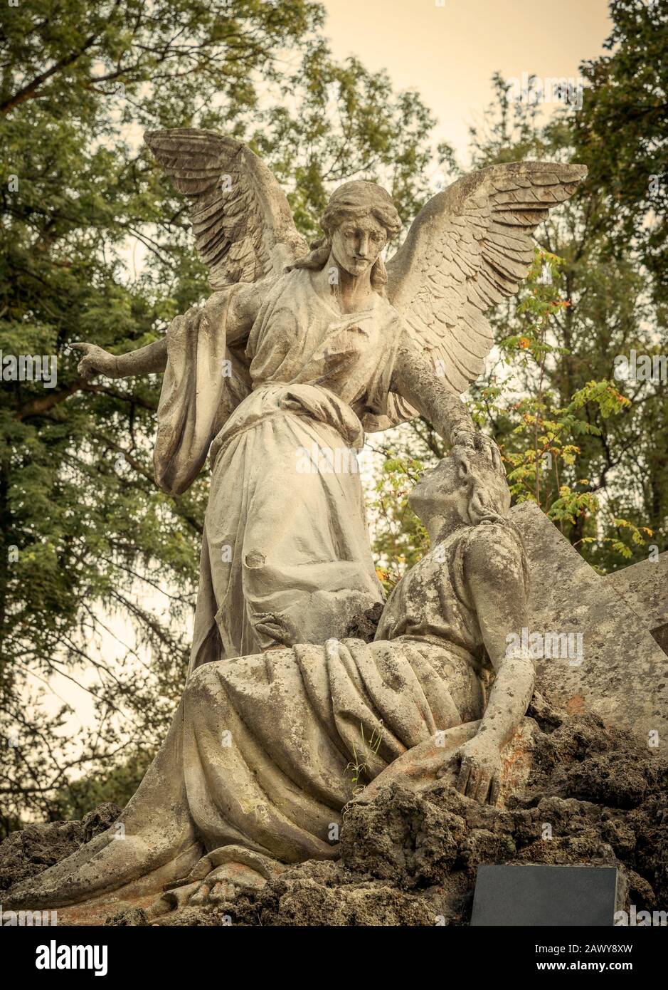 Angel stone statue on an old cemetery Stock Photo - Alamy