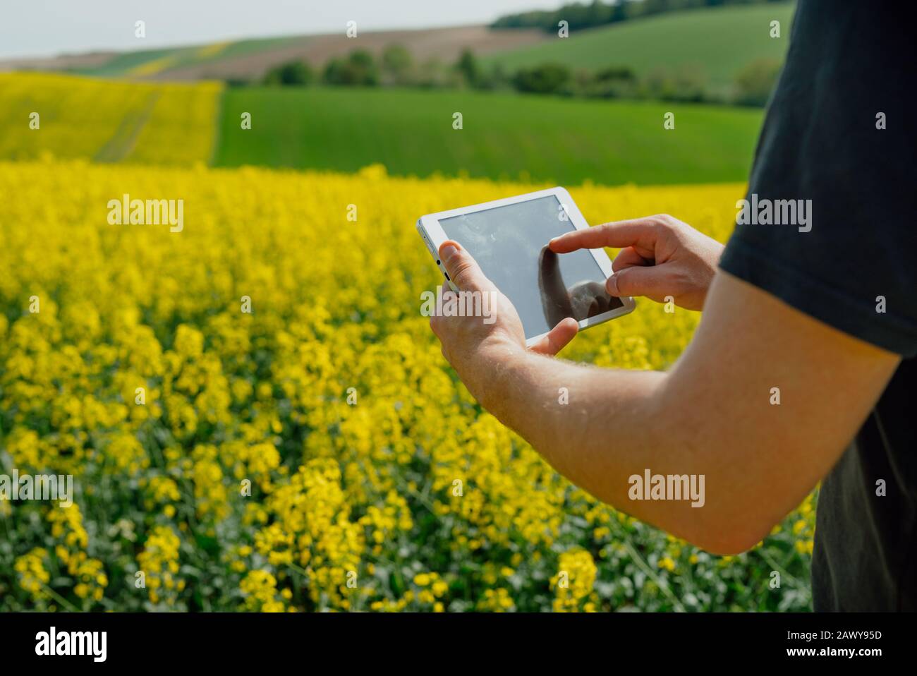 Farmer holding tablet Stock Photo - Alamy