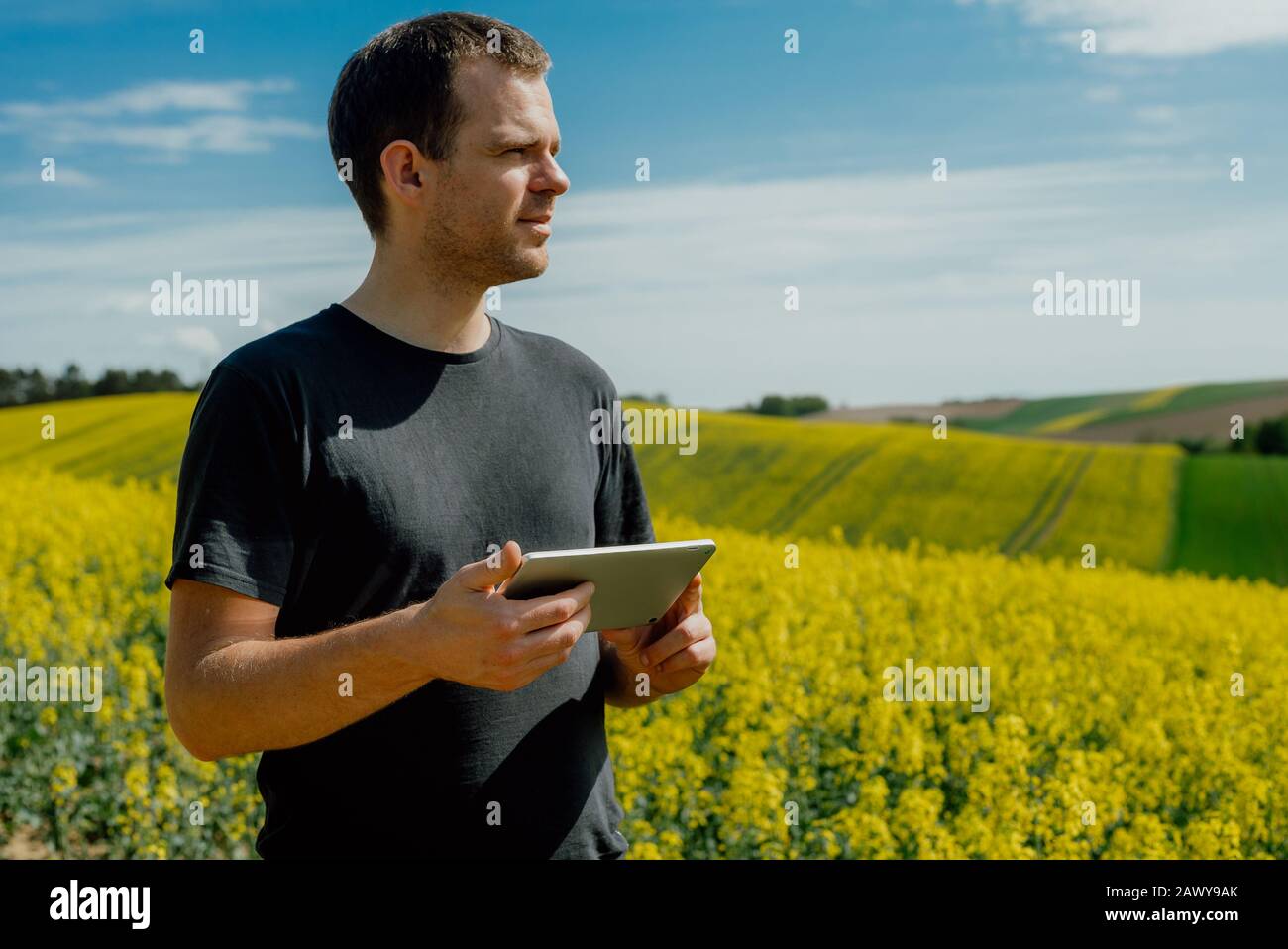 Farmer holding tablet Stock Photo - Alamy