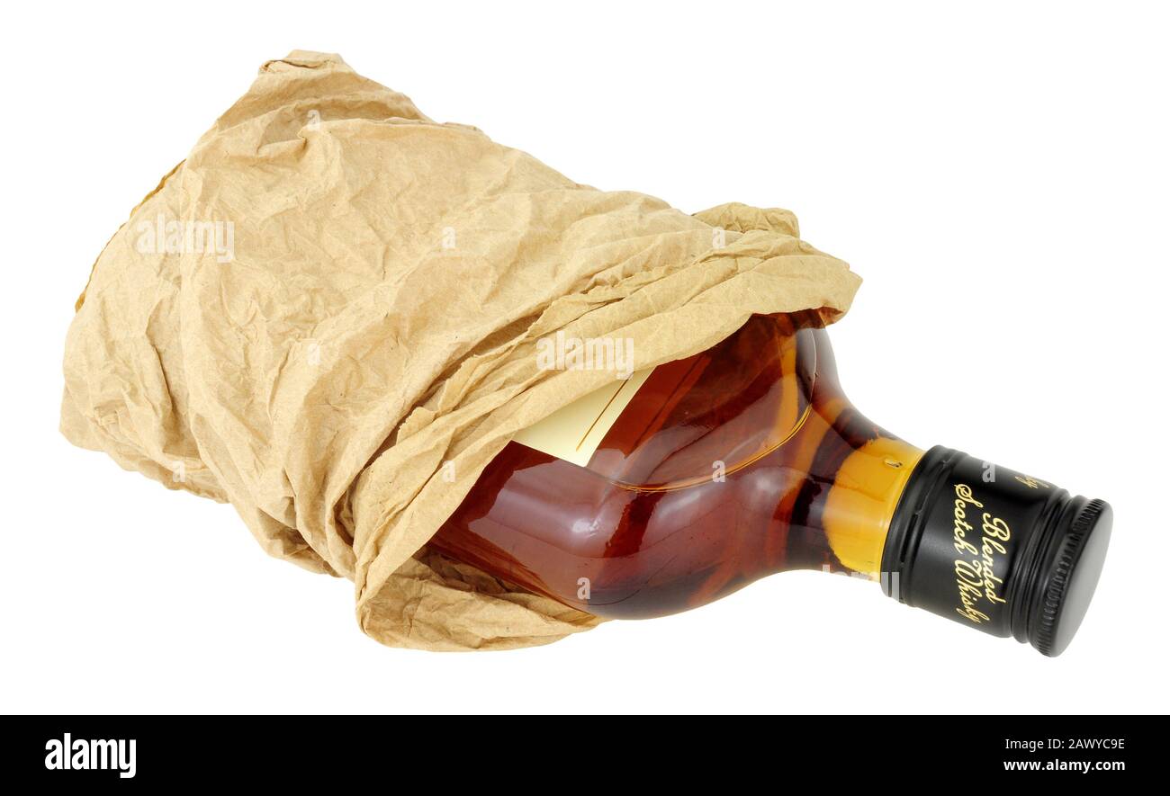 Bottle of Scotch whisky wrapped in a brown paper bag isolated on a ...