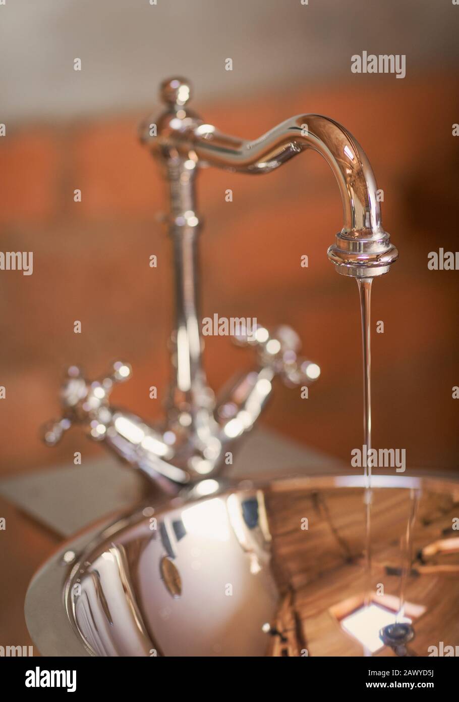 Close up water flowing from stainless still sink and basin Stock Photo ...