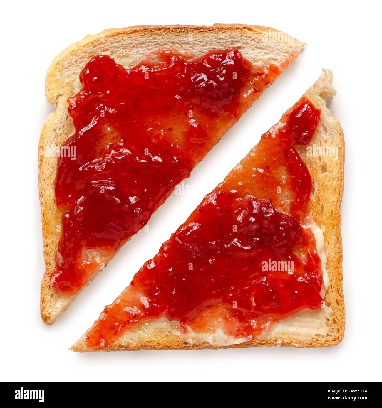 Two triangles of white toast spread with butter and strawberry jam ...