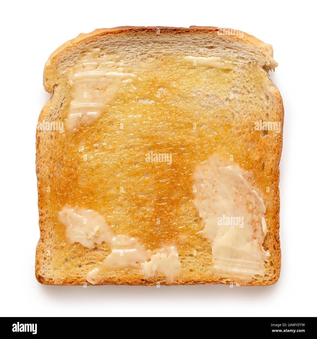 Single slice of white toast spread with butter isolated on white. Top ...