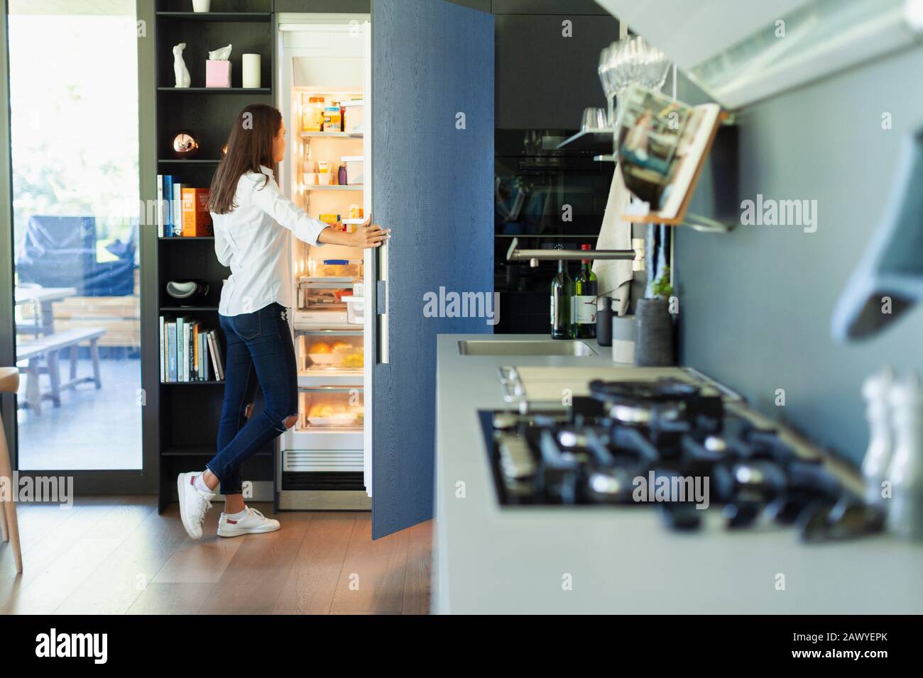 Person opening refrigerator hi-res stock photography and images - Alamy