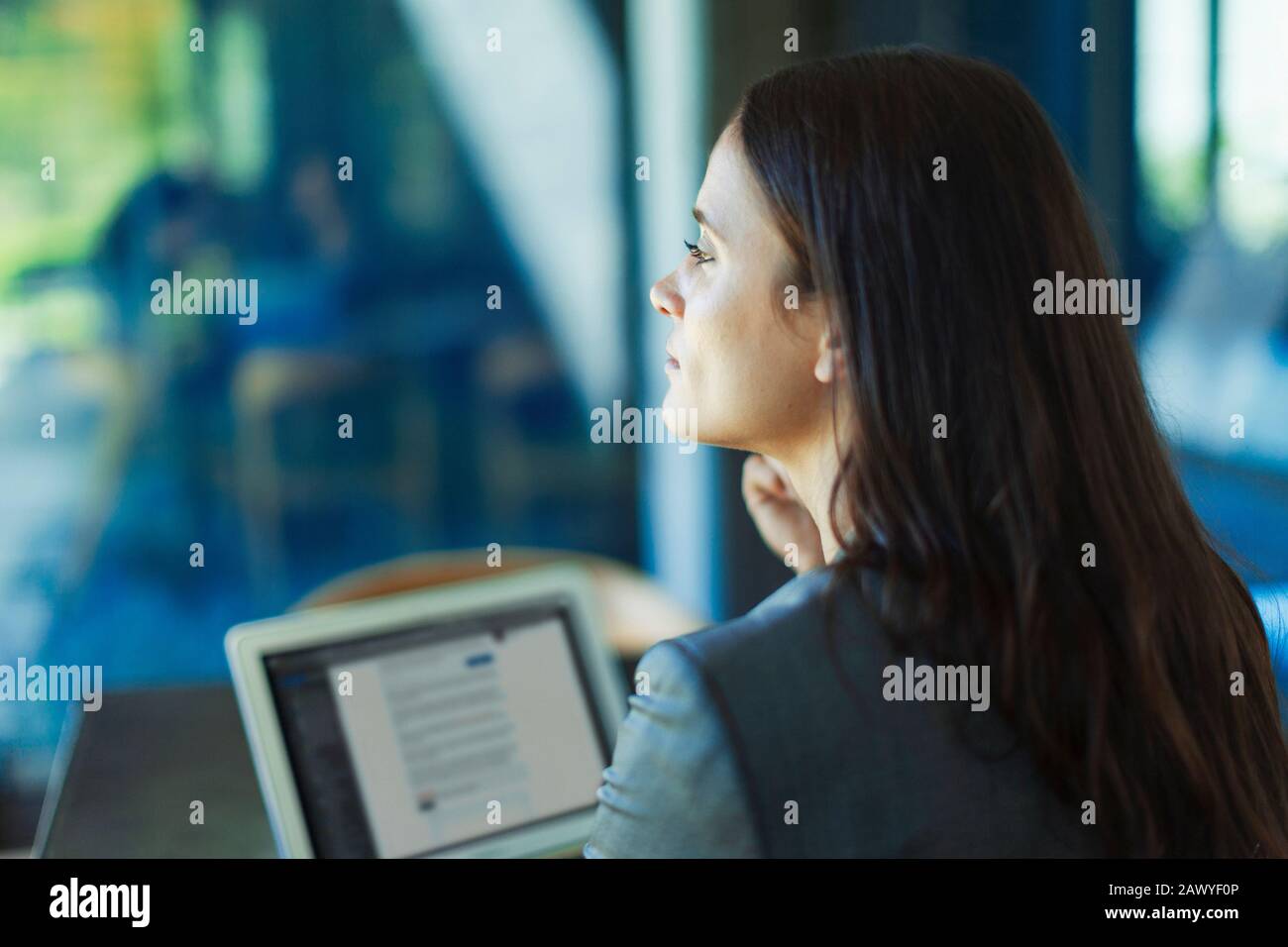 Thoughtful businesswoman working laptop hi-res stock photography and ...