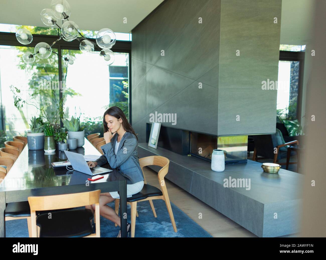 Sitting at dining table laptop hi-res stock photography and images - Alamy