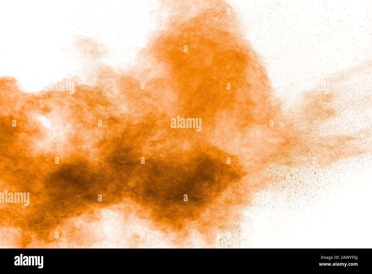 abstract orange powder explosion on white background. Freeze motion of ...