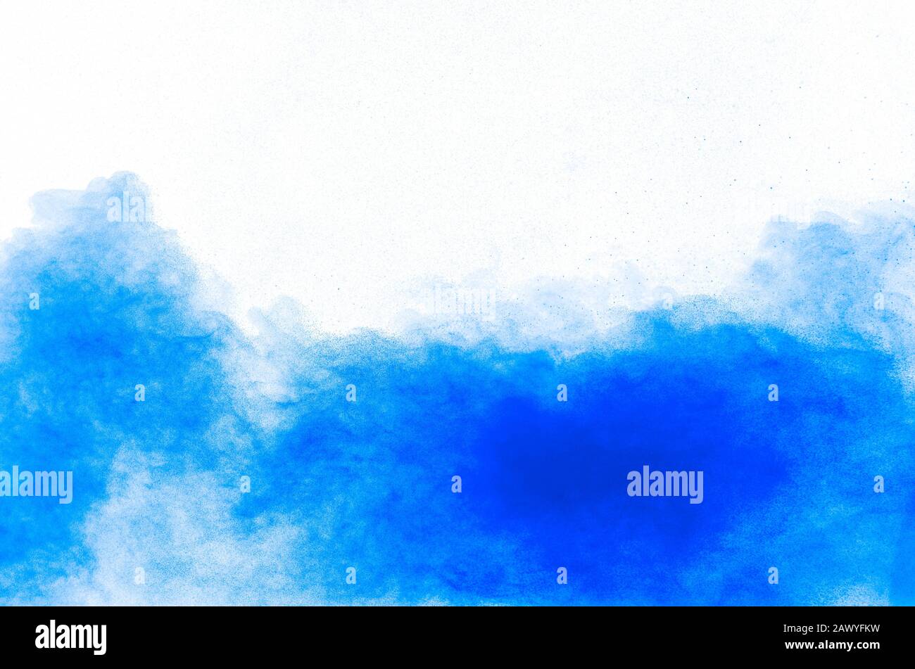 Blue color powder explosion cloud on white background.Closeup of Blue ...