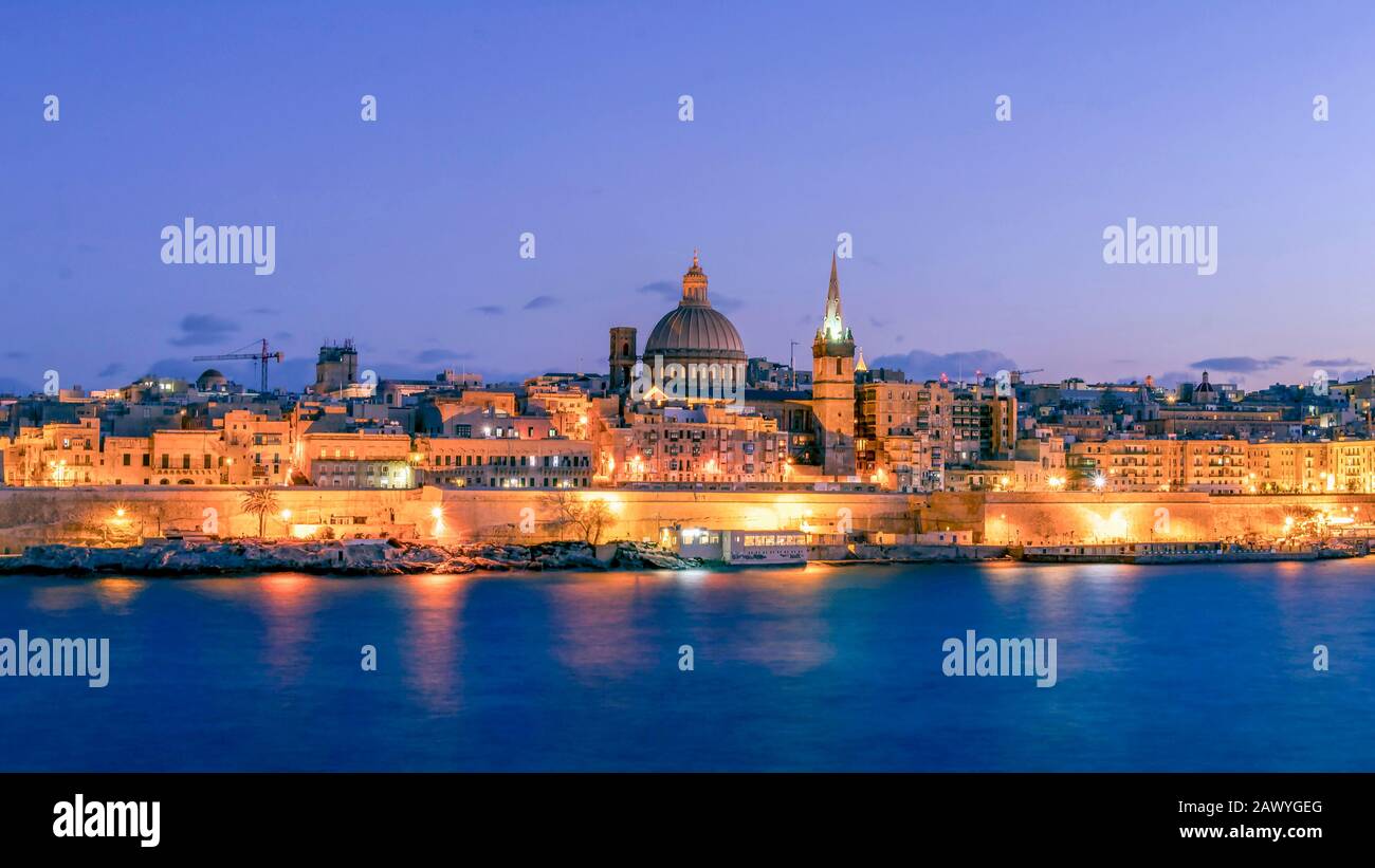 Panoramic view of Valletta at night, seafront skyline of the capital ...