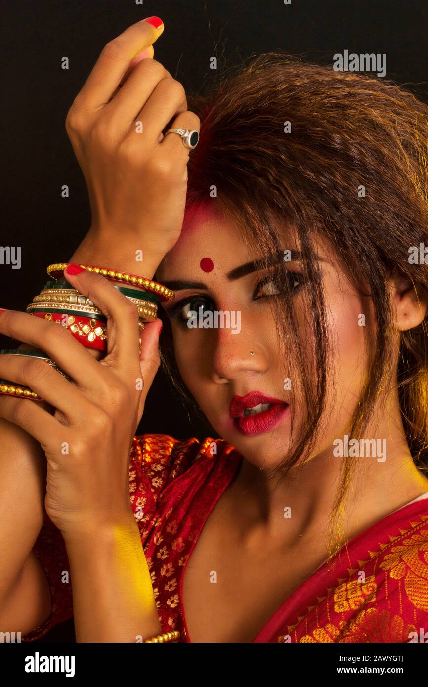 Portrait of an young and beautiful Indian Bengali brunette woman with ...