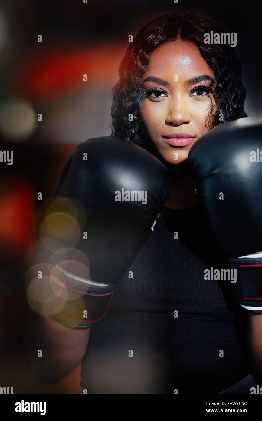 Young woman in boxer gloves hi-res stock photography and images - Alamy
